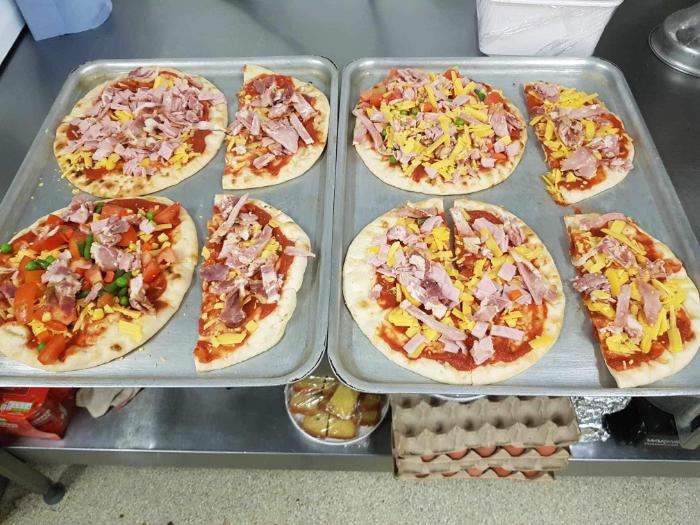 Pizza Party Fun: Residents Craft Homemade Pizzas for Tea Time Delights ...